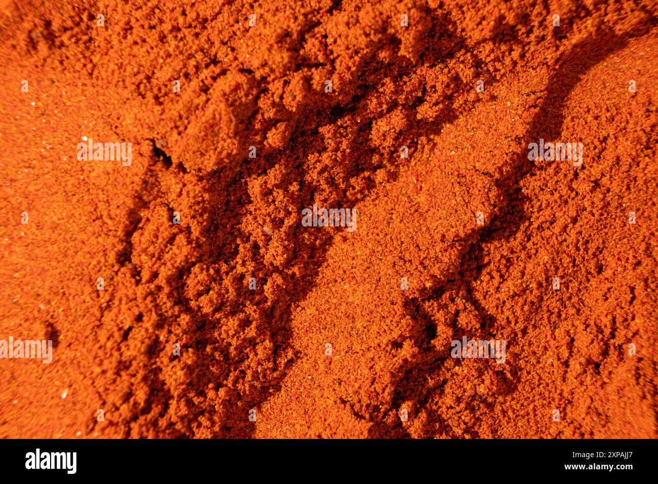 Ground paprika, red terracotta spice background, art in cooking Stock ...