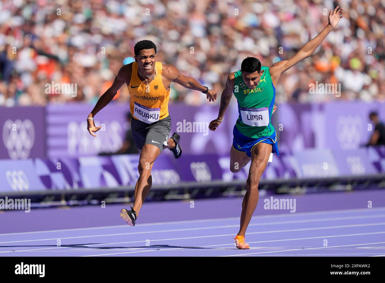 Joshua Abuaku, of Germany, and Matheus Lima, of Brazil, cross the ...