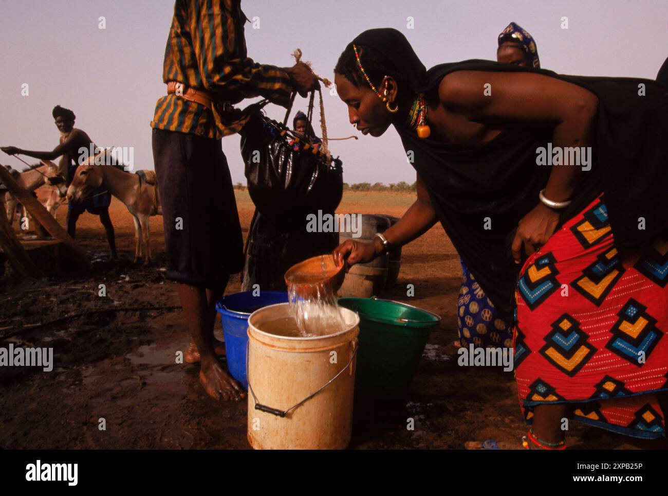A woman gathers water in the Teidoum Village, Mali, West Africa Stock ...