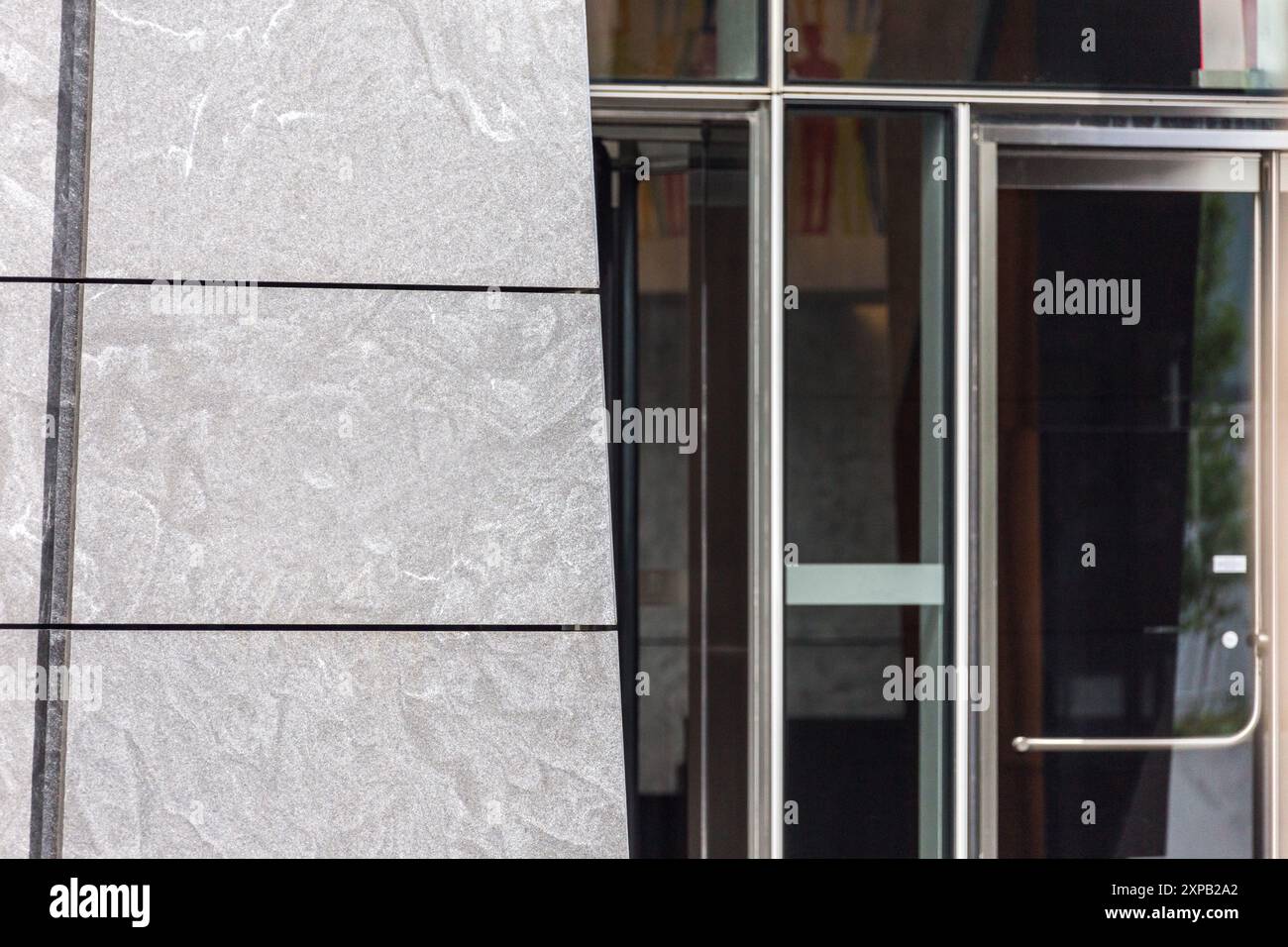 Concrete facade of an office building entrance. Empty space for logo or ...