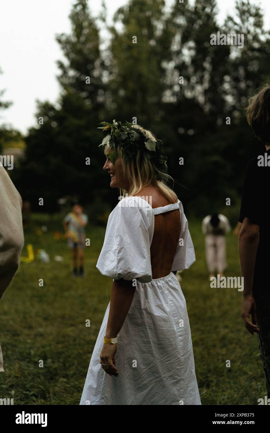 Woman in wreath and national Slavic clothing, holiday of Ivan Kupala ...