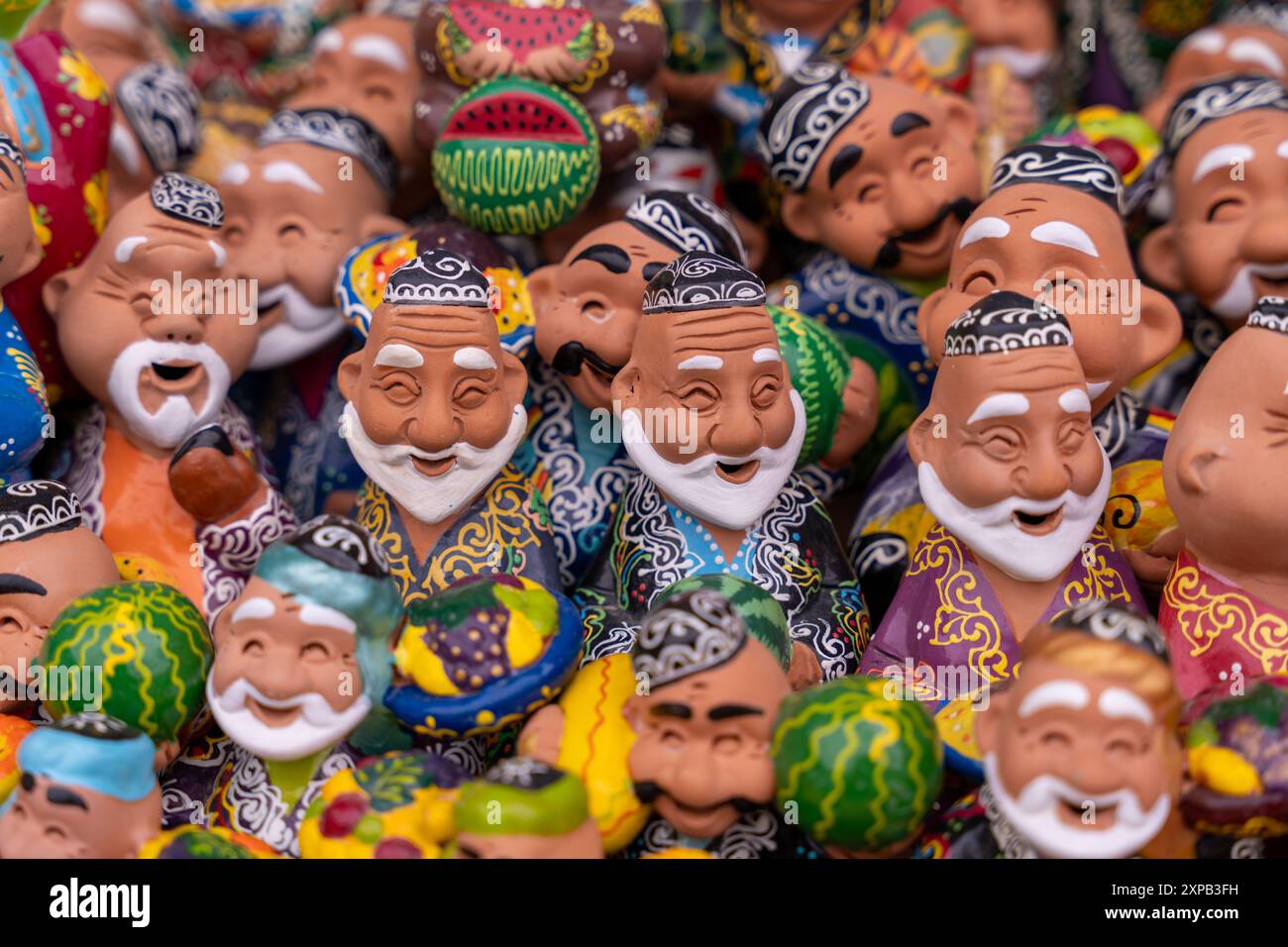 A collection of small figurines, some of which are smiling Stock Photo ...