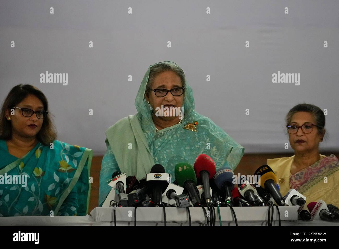 FILE- Bangladesh Prime Minister Sheikh Hasina, centre, is flanked by ...
