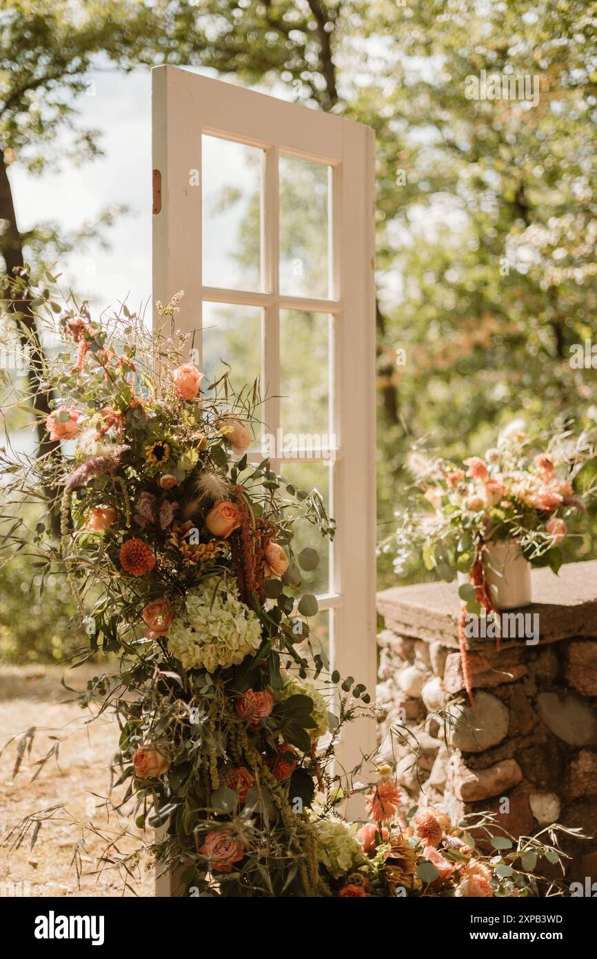 Floral wedding arrangement on a rustic window frame Stock Photo - Alamy