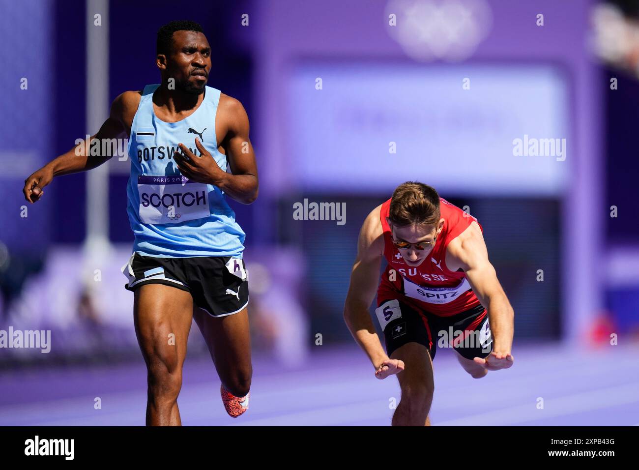 Lionel Spitz, right, of Switzerland, falls as Leungo Scotch, of ...