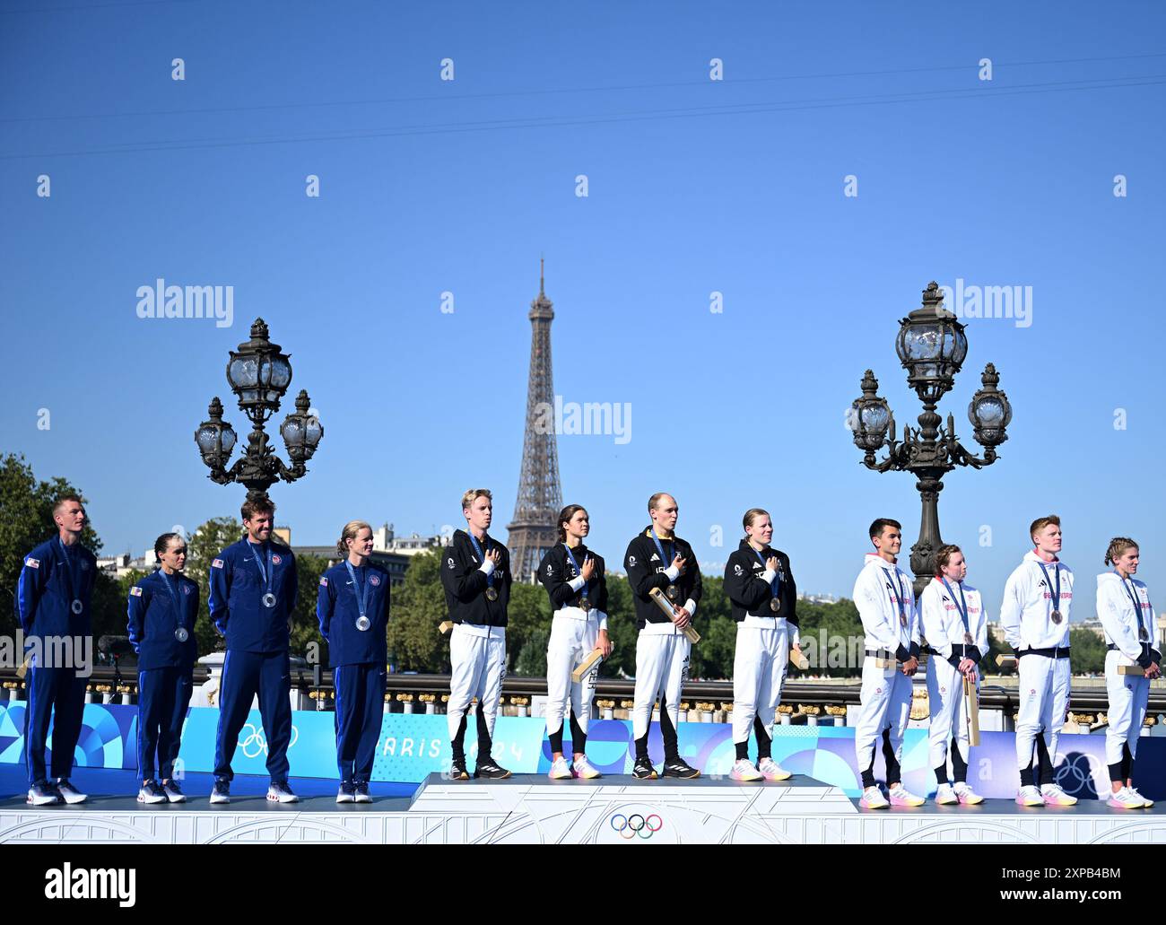 Paris, France. 5th Aug, 2024. Gold medalists team Germany (C), silver medalists team USA (L) and ...