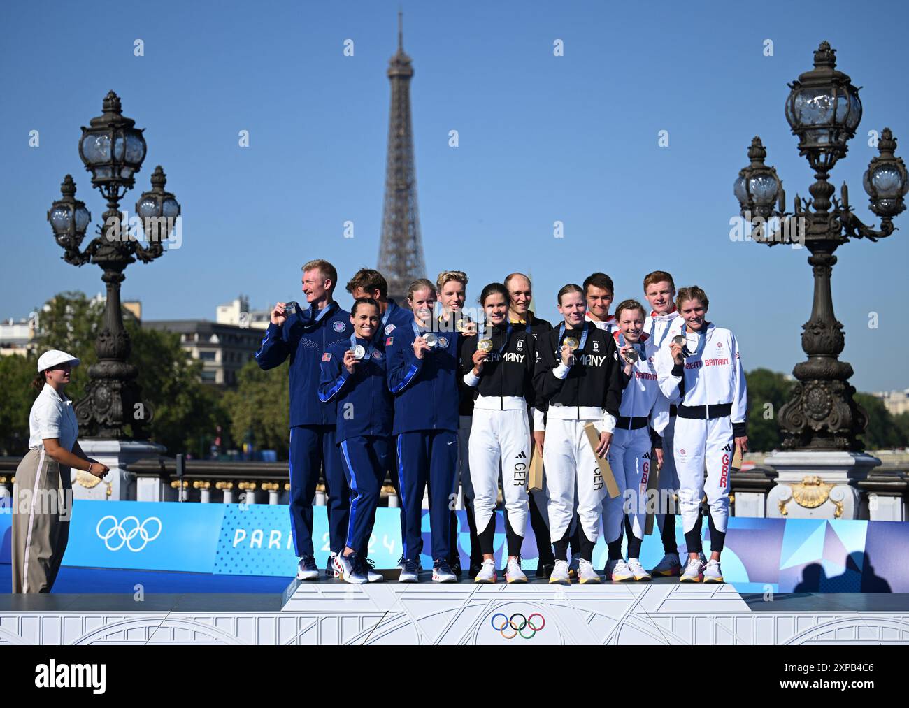 Paris, France. 5th Aug, 2024. Gold medalists team Germany (C), silver medalists team USA (L) and ...
