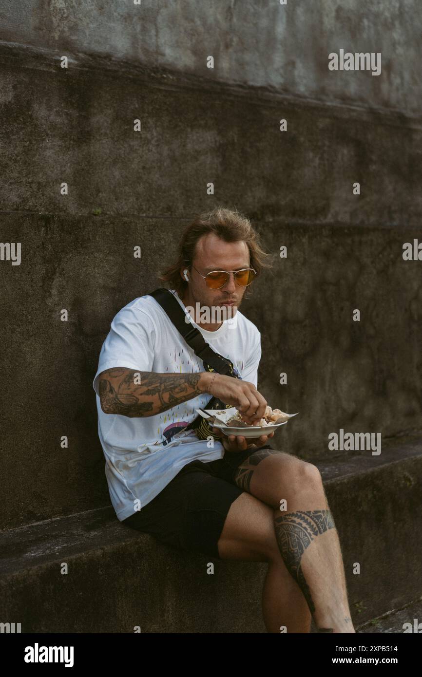 A man eating local food in Bali Stock Photo - Alamy