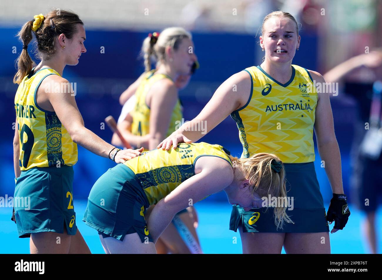 Australia's Stewart Tatum, right, comforts teammate after their loss ...