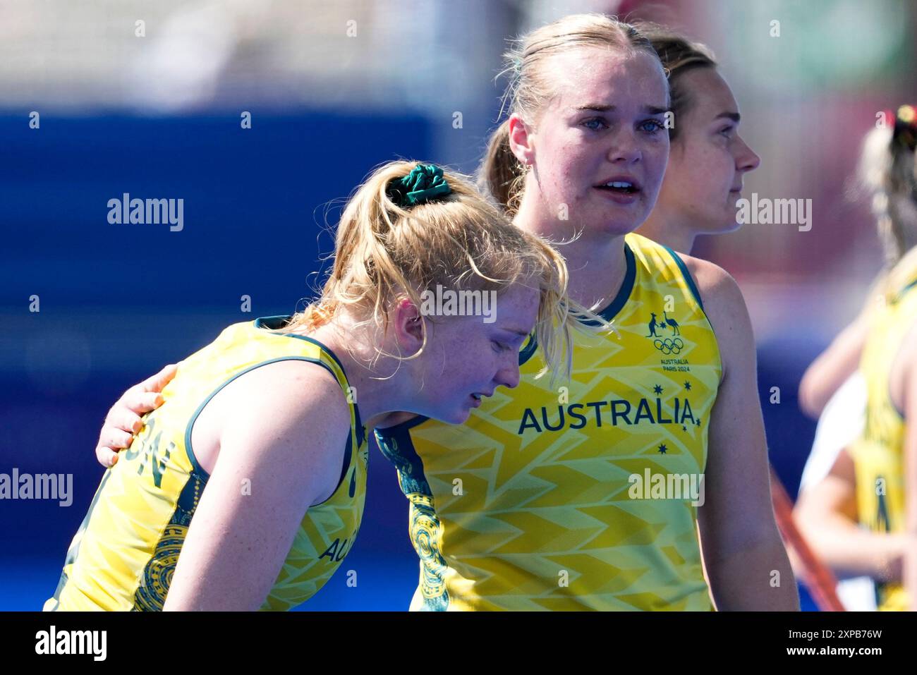 Australia's Stewart Tatum, right, comforts teammate after their loss ...