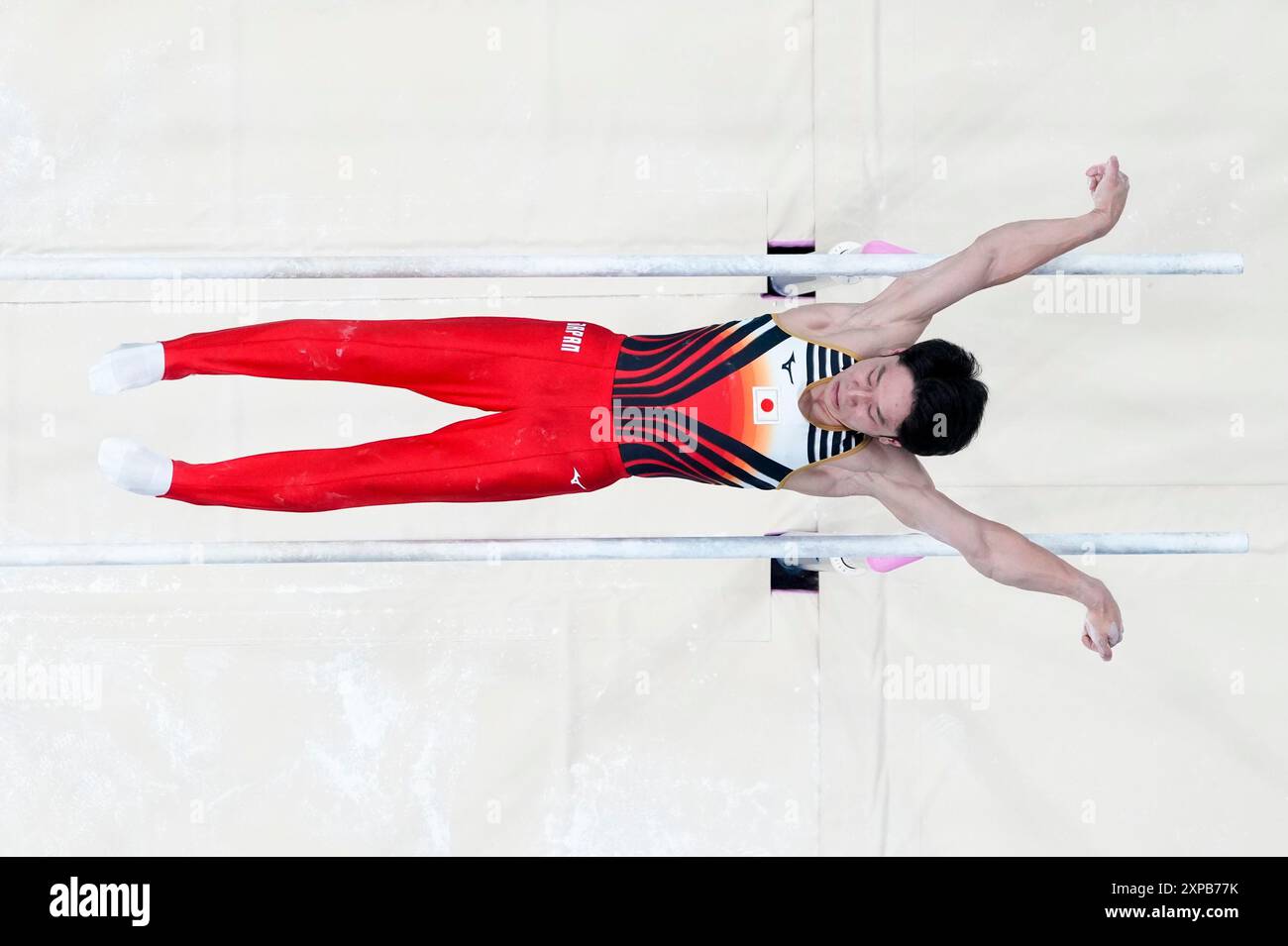 Wataru Tanigawa, of Japan, performs on the parallel bars during the men ...