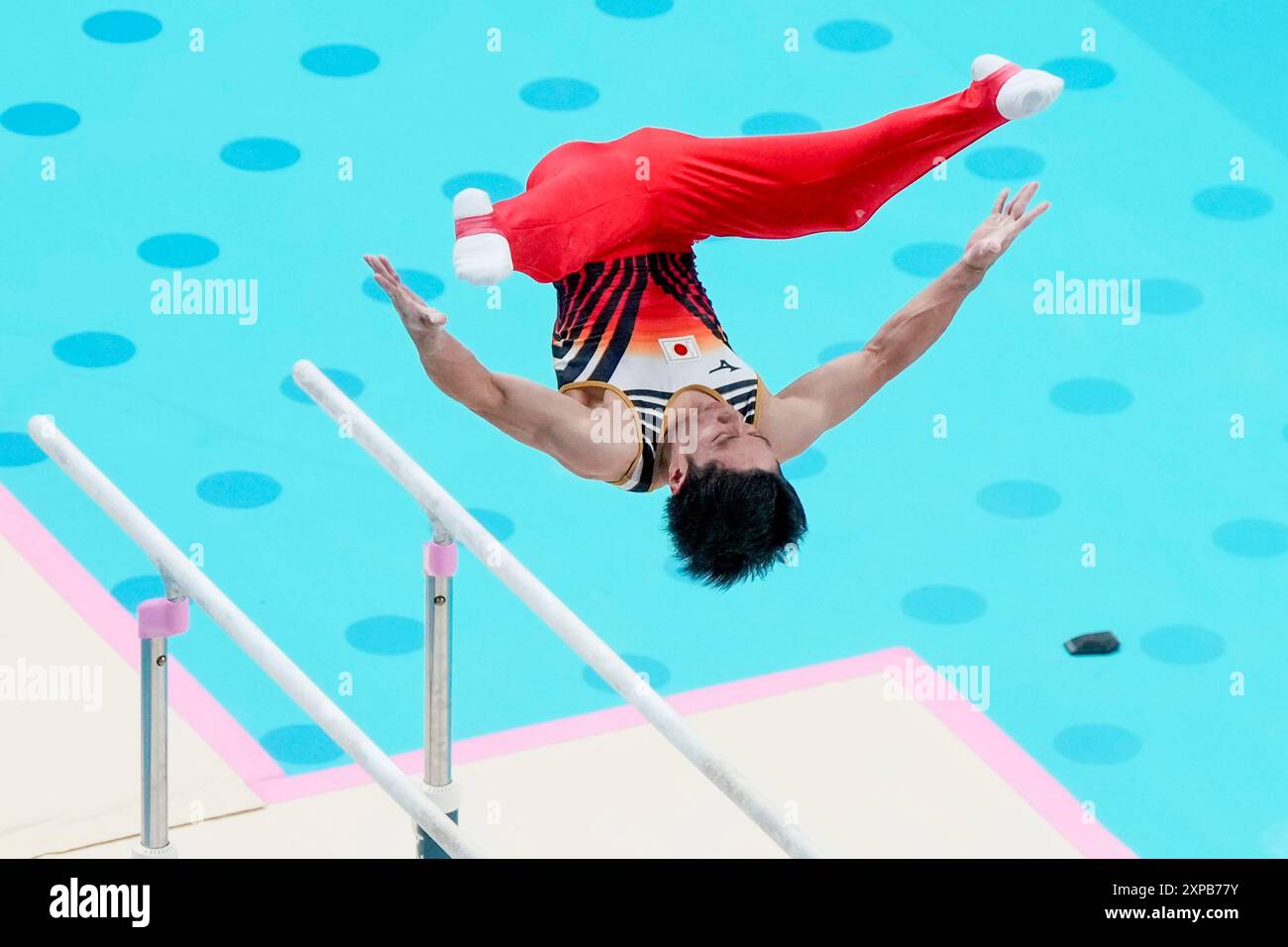 Wataru Tanigawa, of Japan, performs on the parallel bars during the men ...