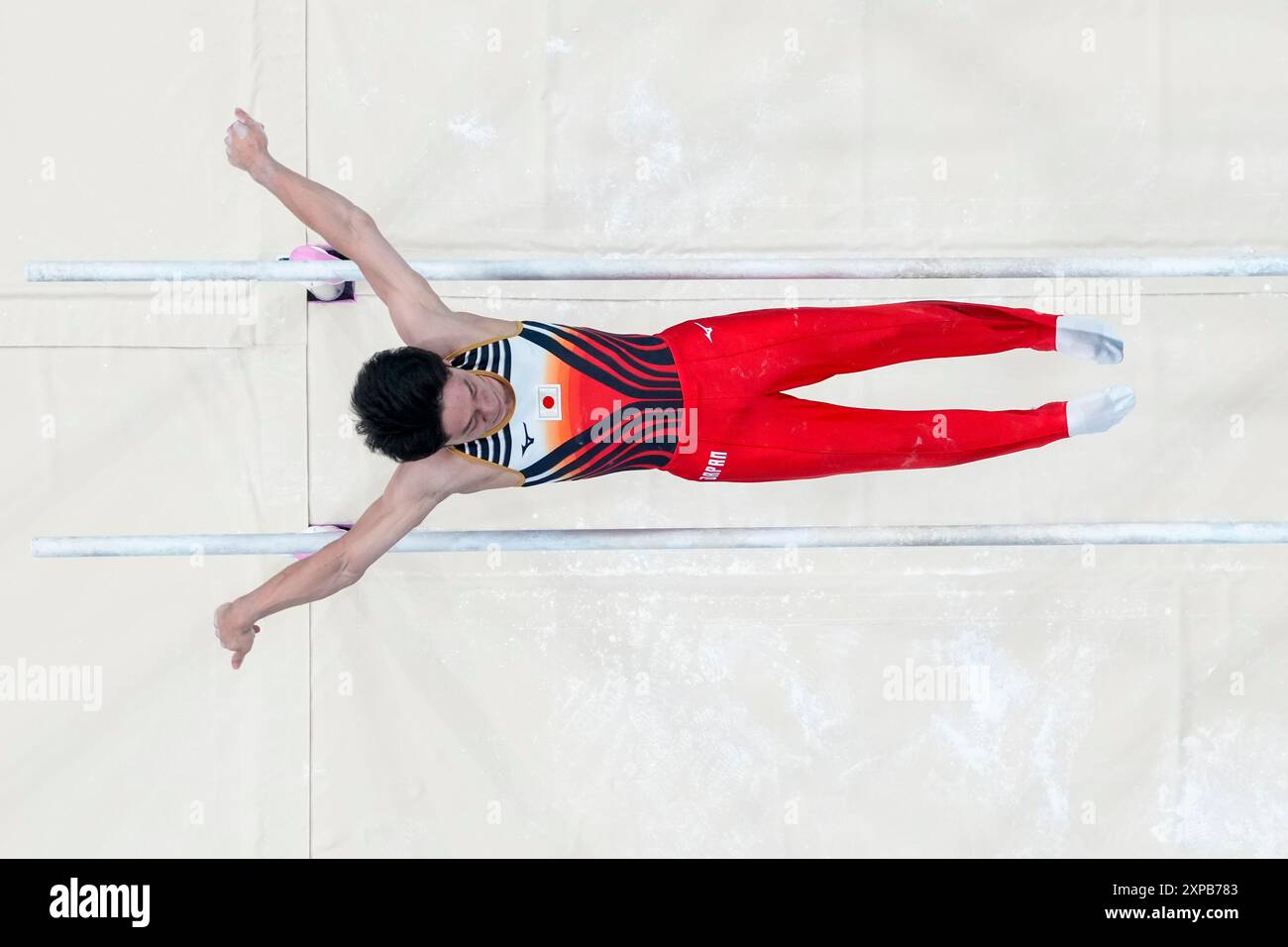 Wataru Tanigawa, of Japan, performs on the parallel bars during the men ...