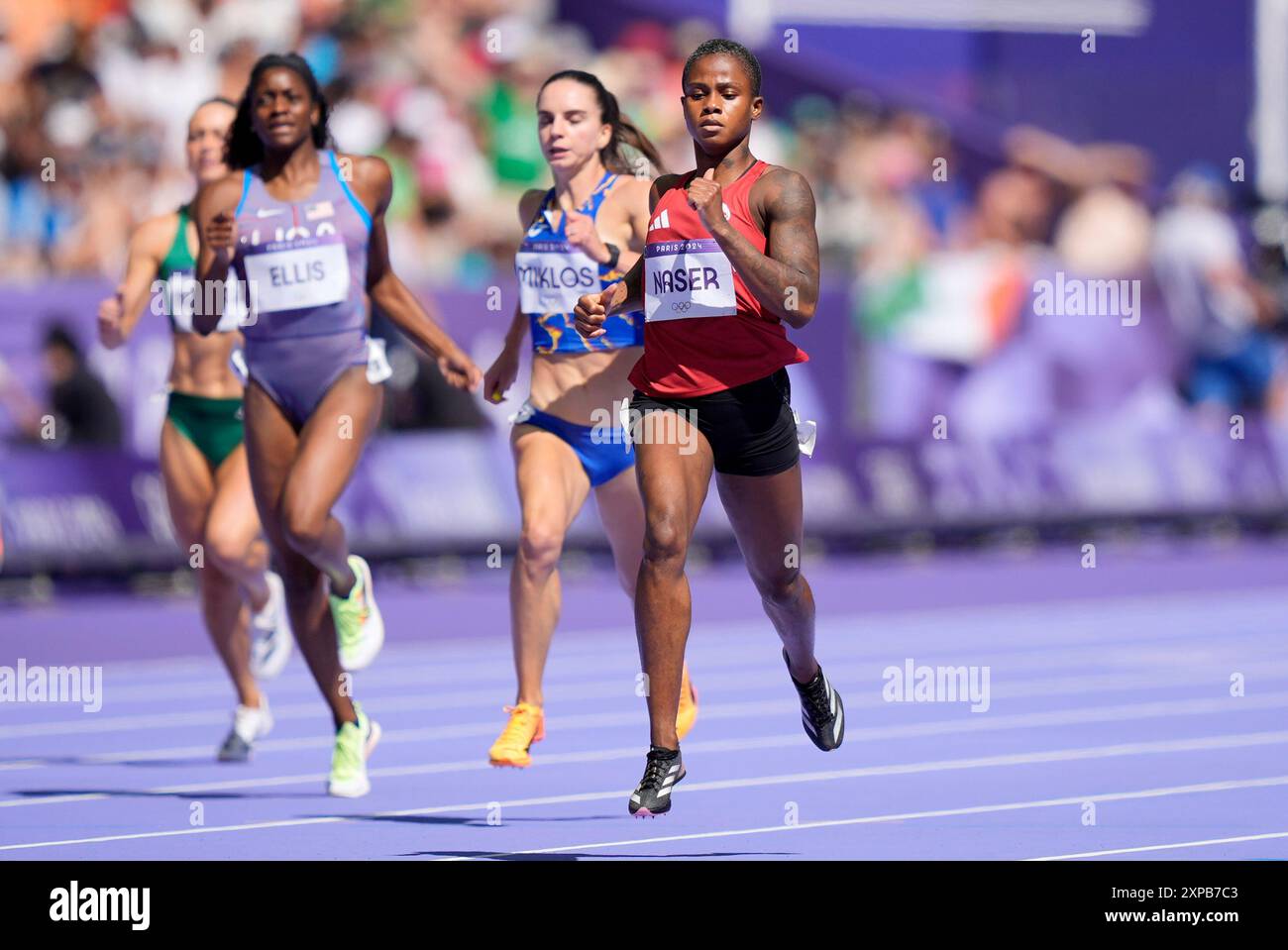 Salwa Eid Naser, of Bahrain, wins a women's 400 meters round 1 heat at ...