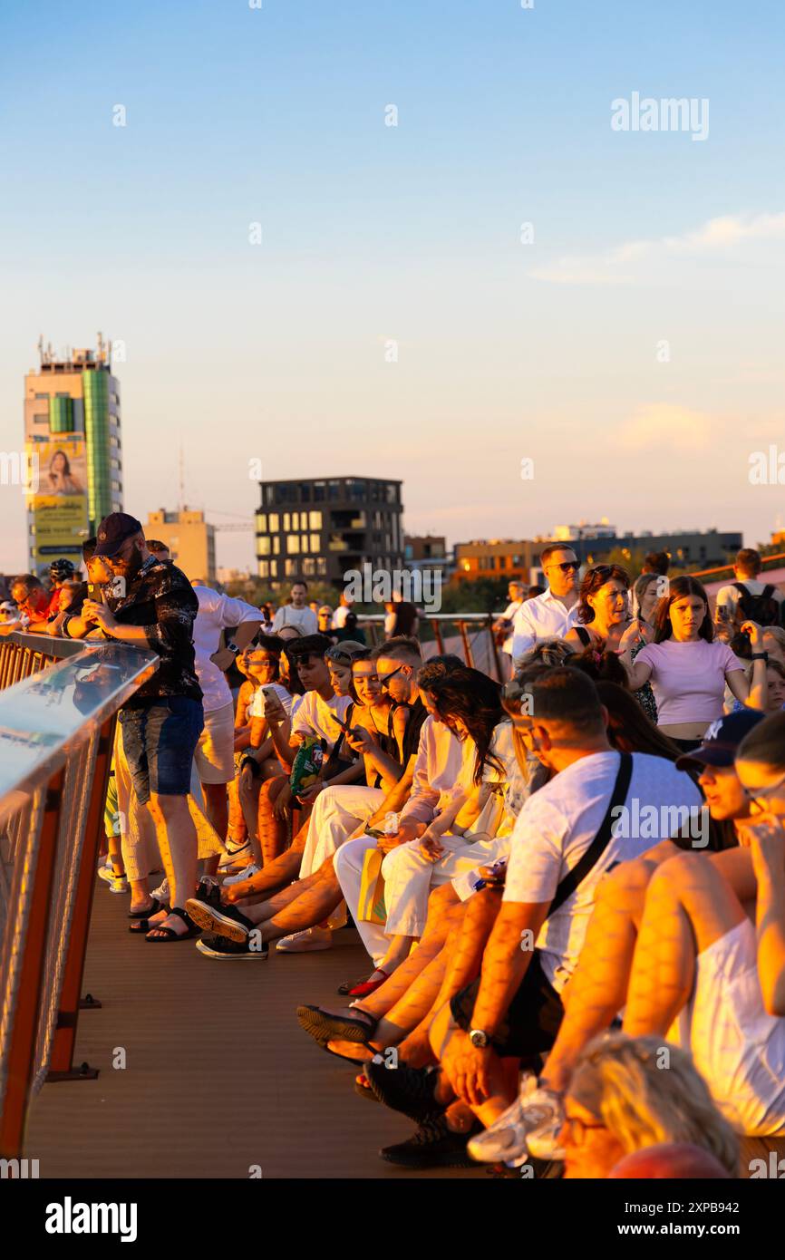 People watching sunset from the newest pedestrian and bicycle bridge ...