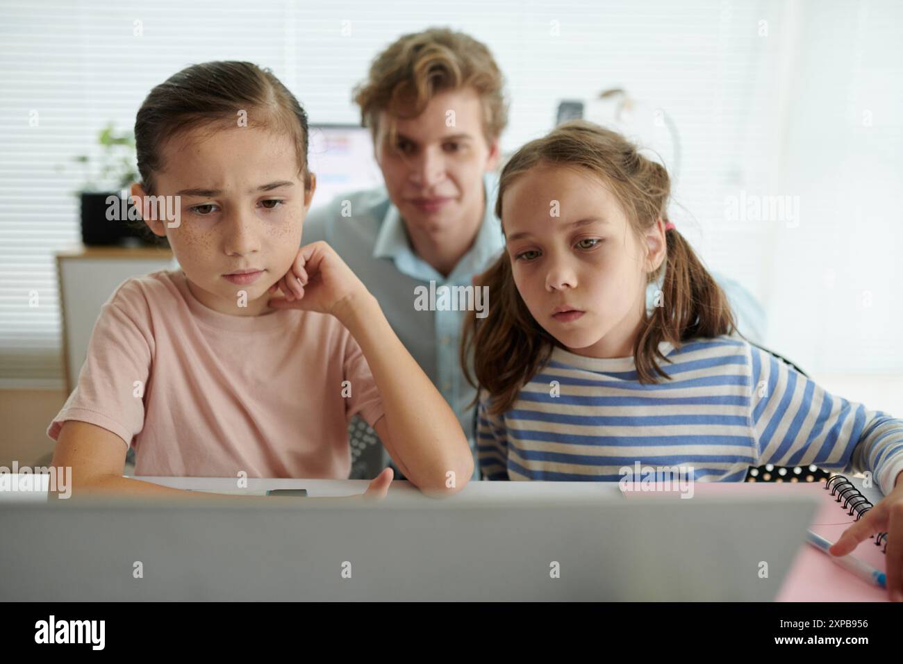 Helping Children with Online Learning Tasks at Home Stock Photo - Alamy