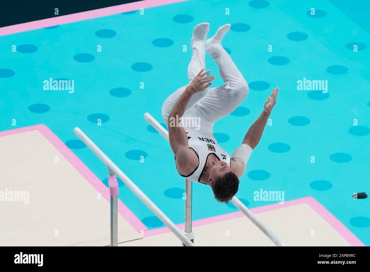 Lukas Dauser, of Germany, performs on the parallel bars during the men ...