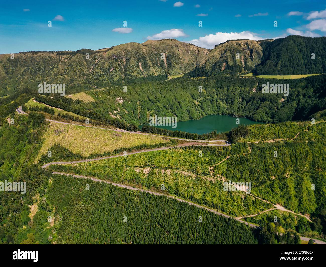 road to Lagoa de Santiago, green terrain, and winding road, Sao Miguel ...