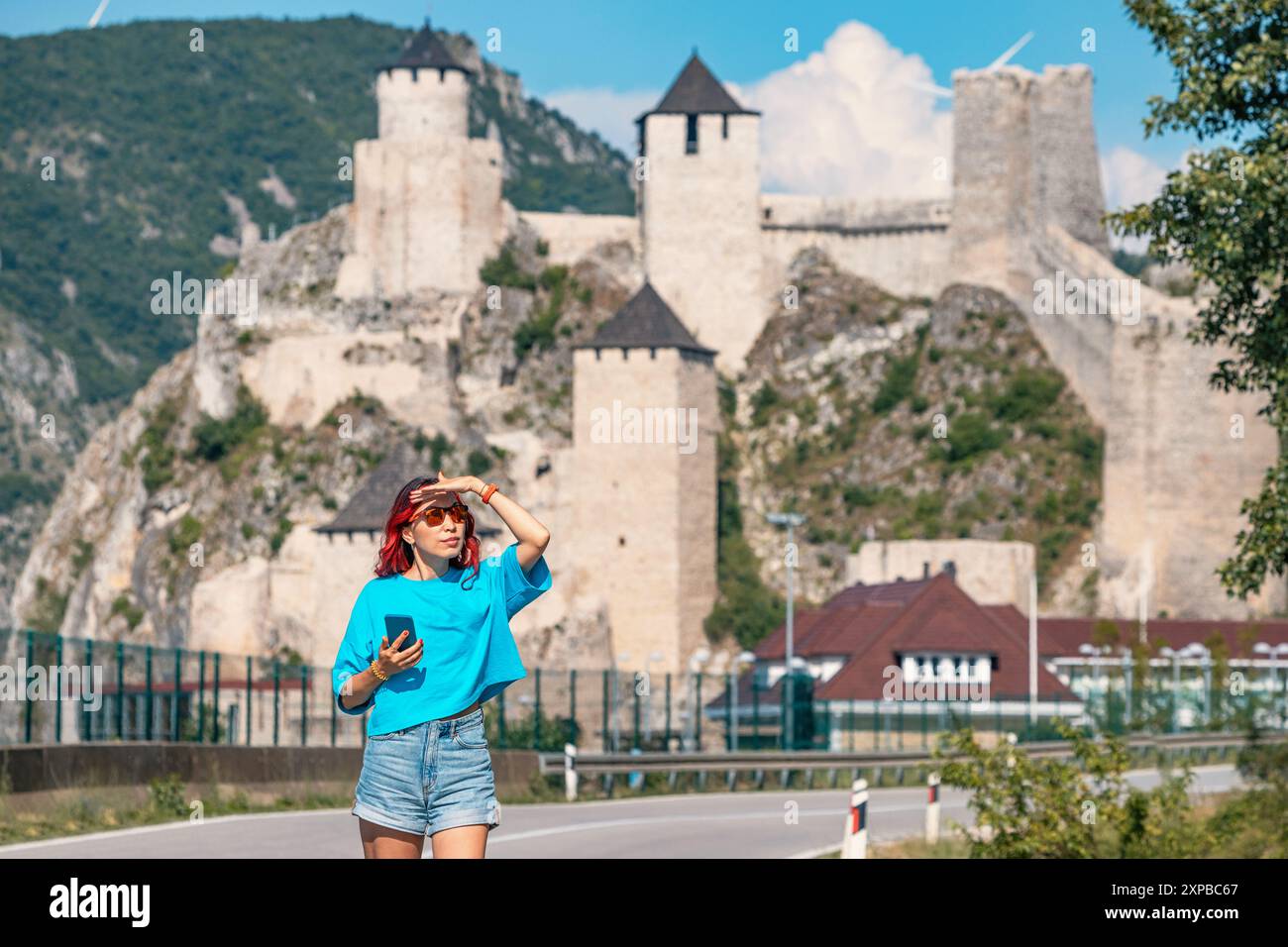 A woman explores Golubac Fortress in Serbia, marveling at its ancient ...