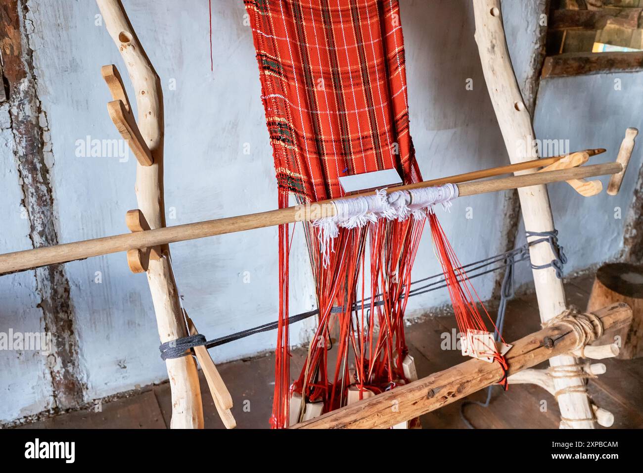 art of weaving with cotton and silk threads on a vintage loom, blending ...