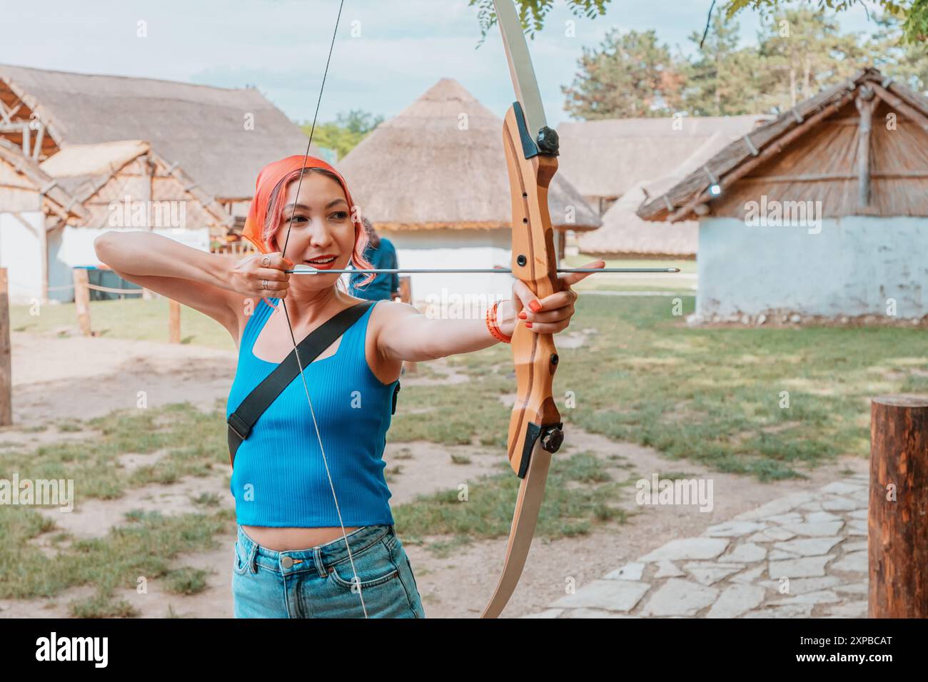 Female archer training for competition with a bow and arrow Stock Photo - Alamy