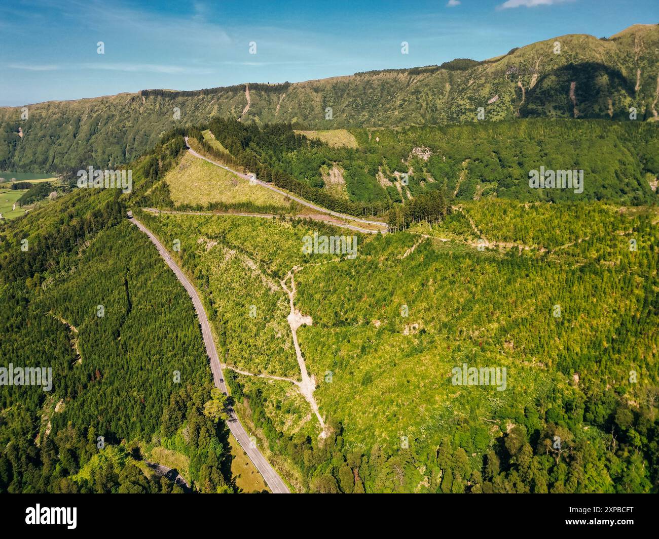 road to Lagoa de Santiago, green terrain, and winding road, Sao Miguel ...