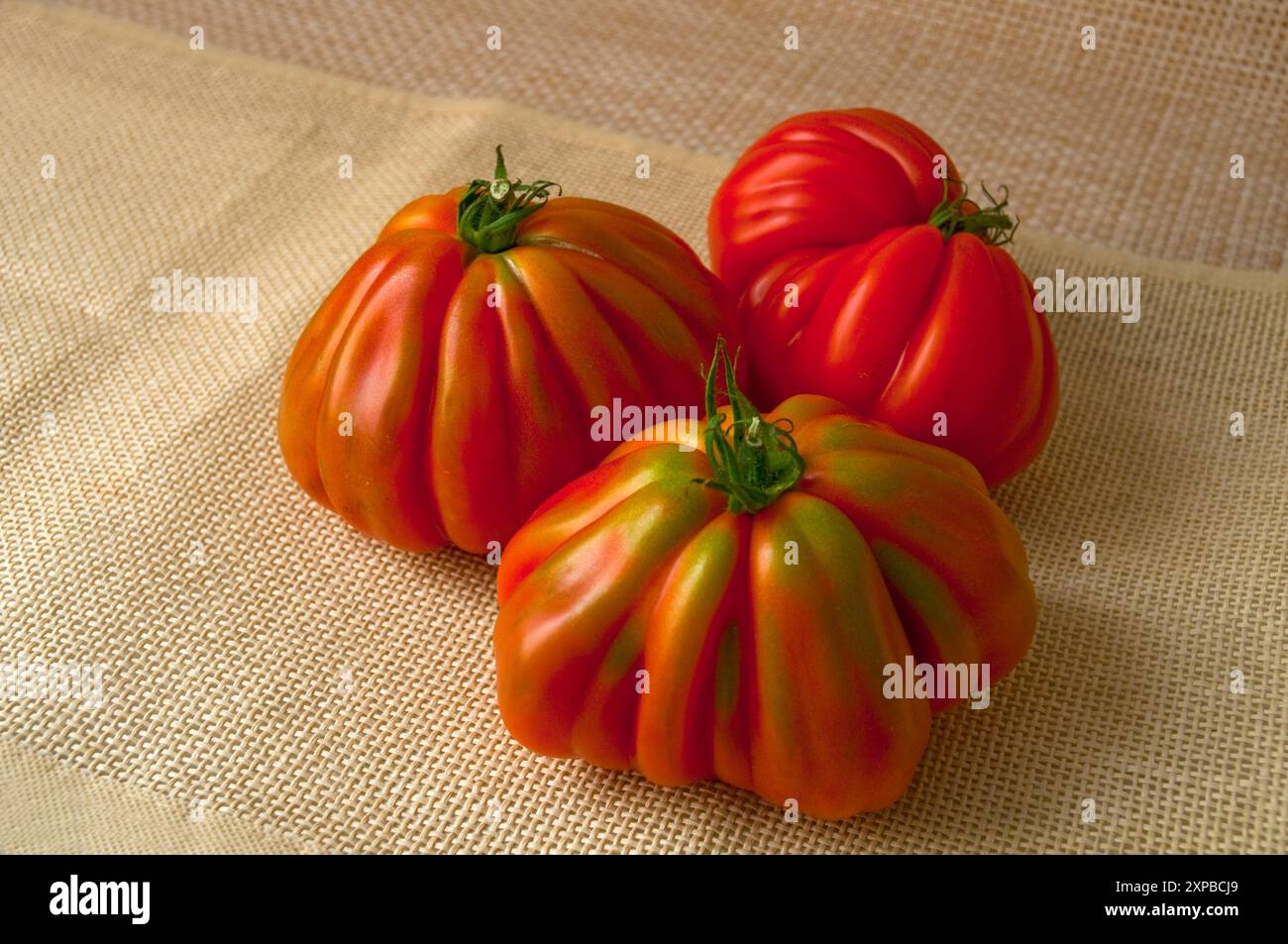 Three raf tomatoes. Still life Stock Photo - Alamy