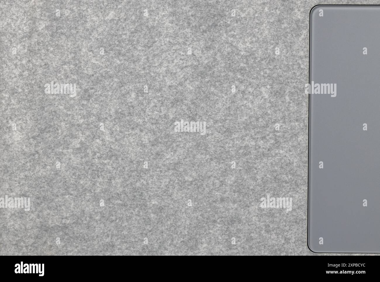 Close up Grey synthetic textile, Alcantara texture use on premium computer notebook. Surface of ...