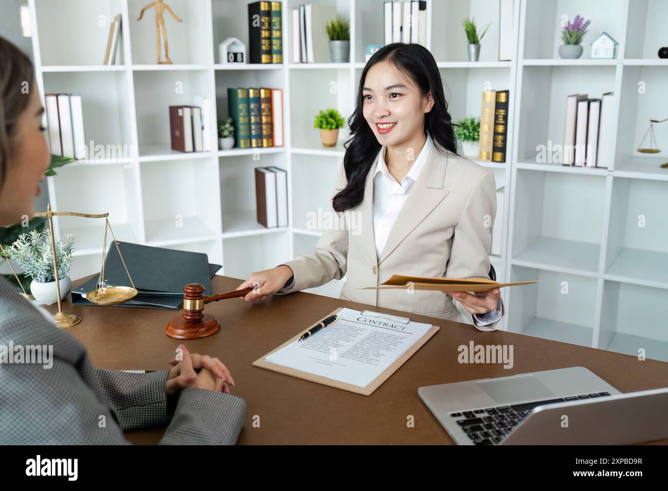 Professional Female Lawyer Discussing Contract with Client in Modern ...