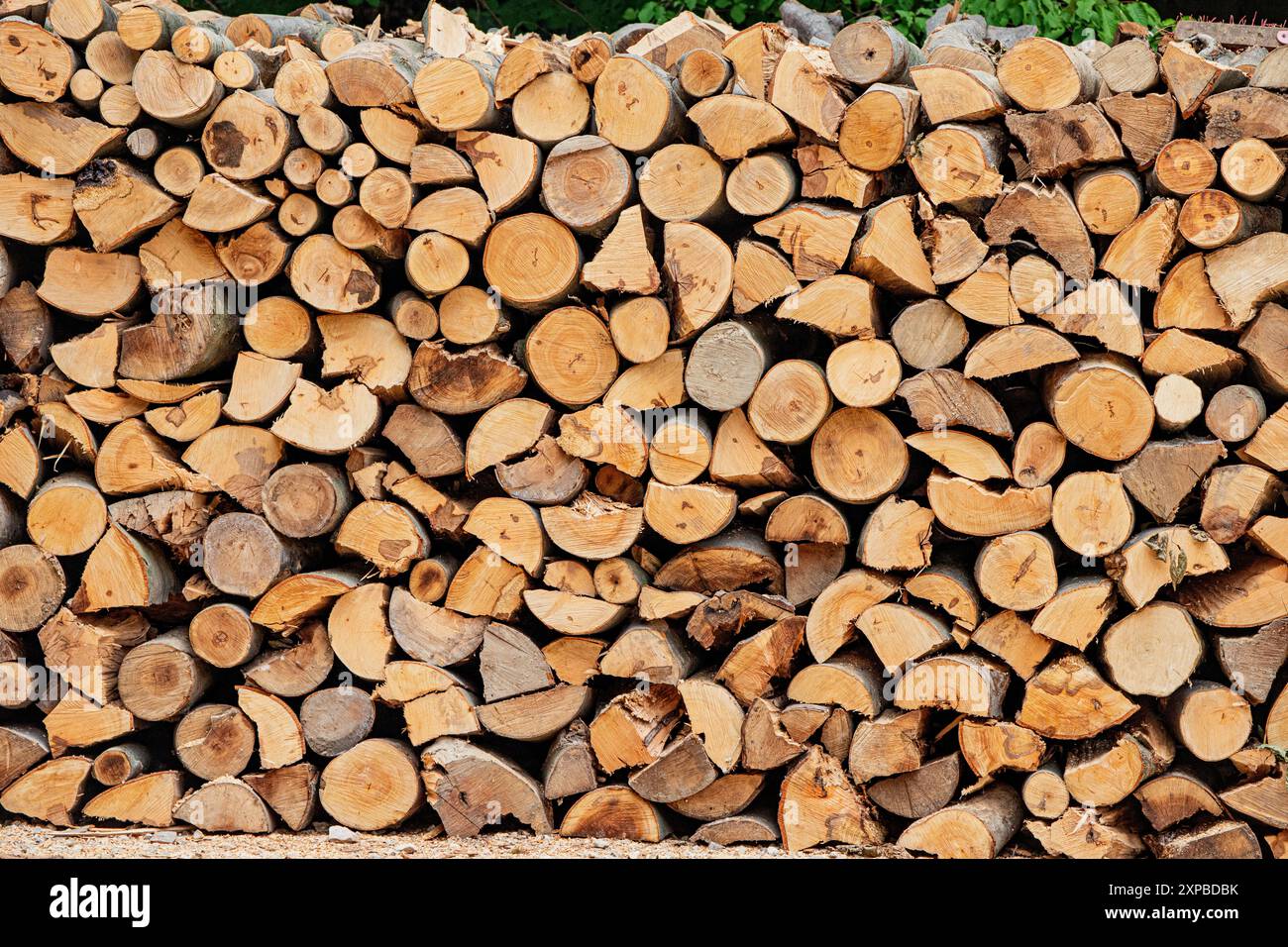 Organized stack of firewood, highlighting its role as a natural energy ...