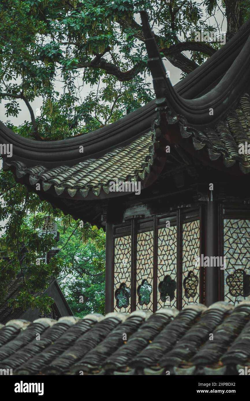 A traditional Chinese garden pavilion in Suzhou, China with a tiled ...