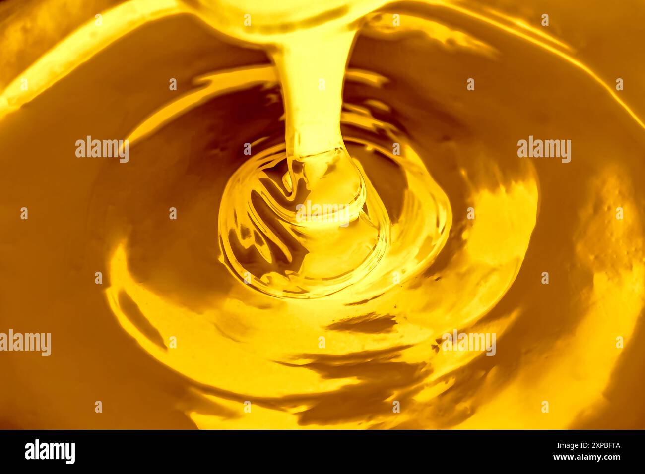 Pouring gold fluid as background, closeup view Stock Photo - Alamy