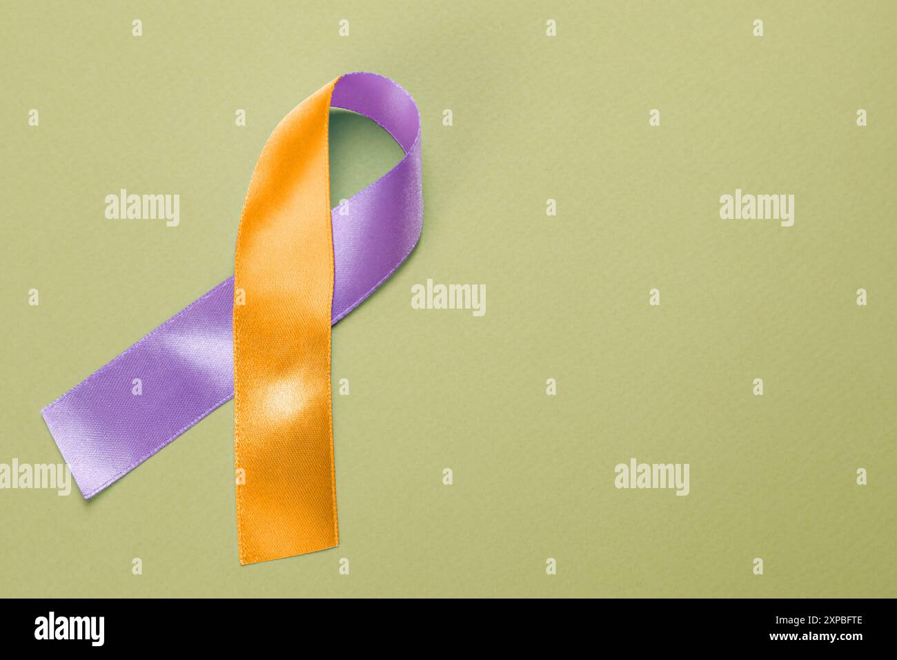 World Psoriasis Day. Orange and orchid awareness ribbon as symbol of ...