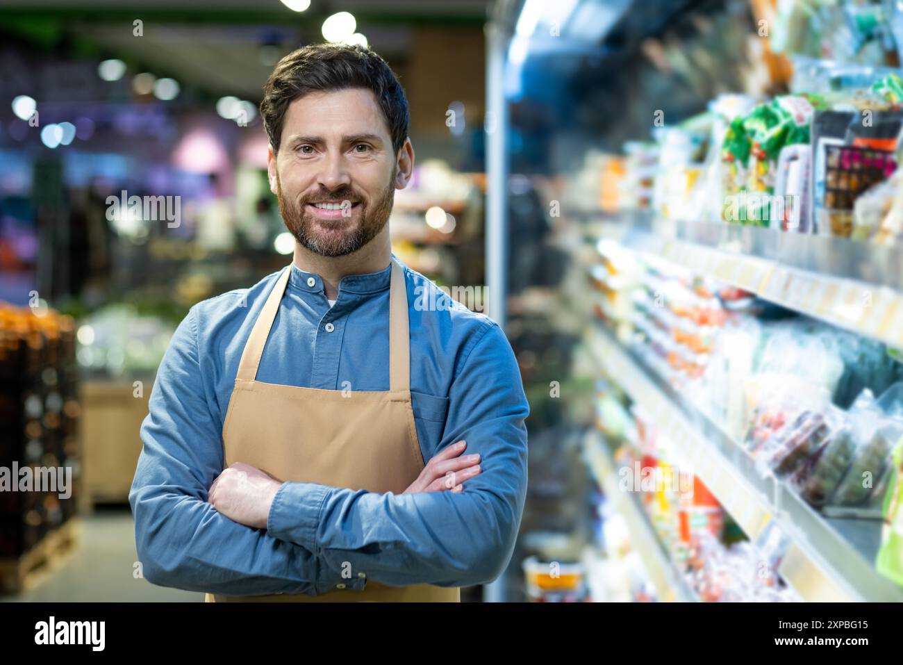 Man in work uniform smiles hi-res stock photography and images - Alamy