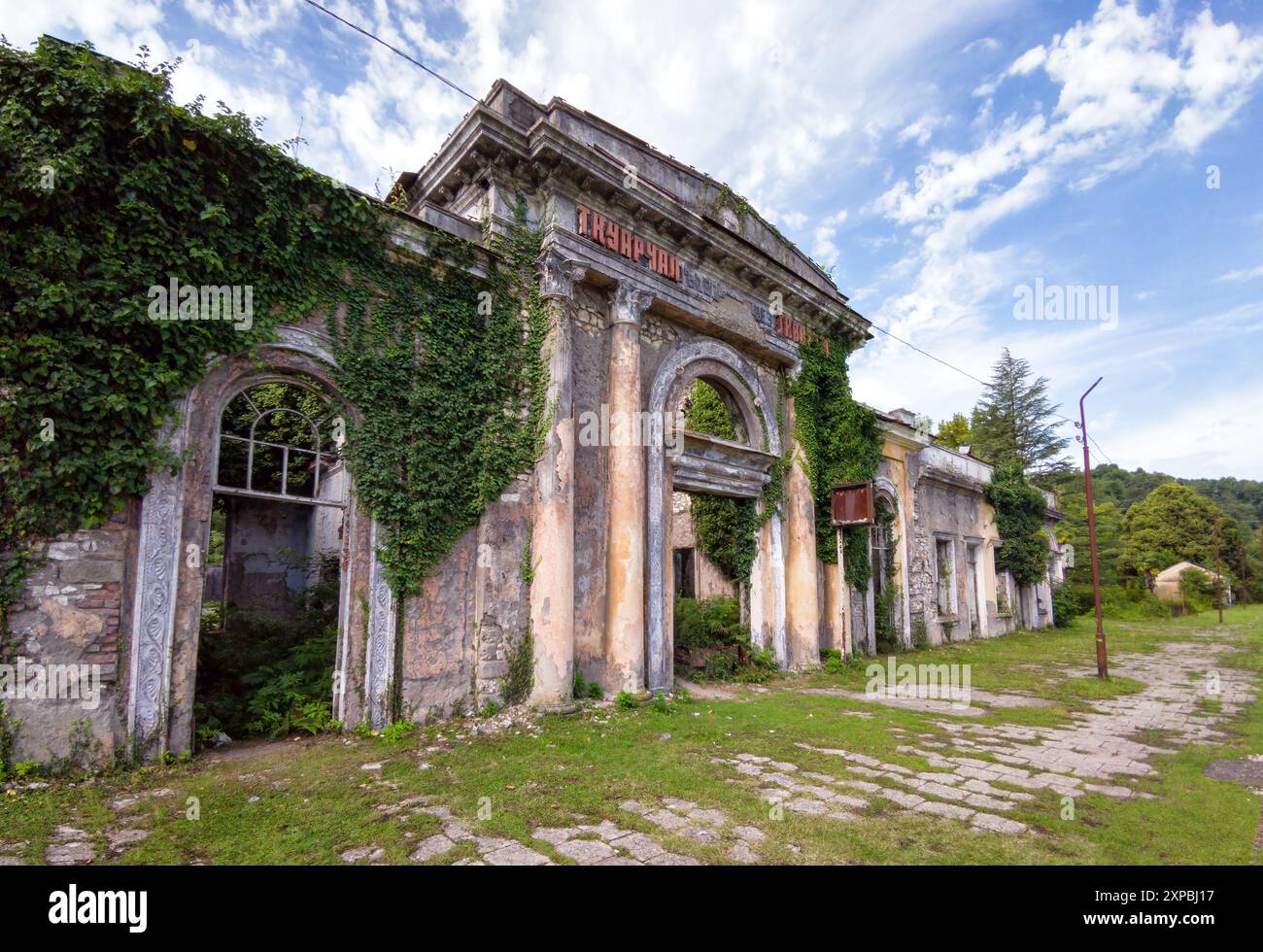 Abandoned railway station in Tkvarcheli city, Abkhazia. Old building ...