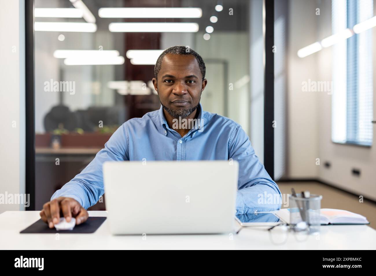 Determined ceo working on laptop hi-res stock photography and images ...