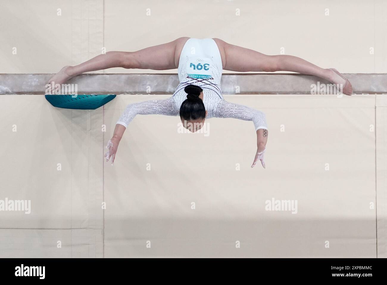 Suni Lee, of the United States, performs on the beam during the women's ...