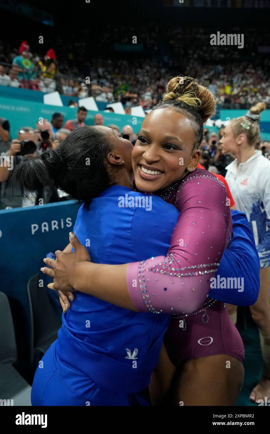 Simone Biles, left, of the United States, and Rebeca Andrade, of Brazil ...