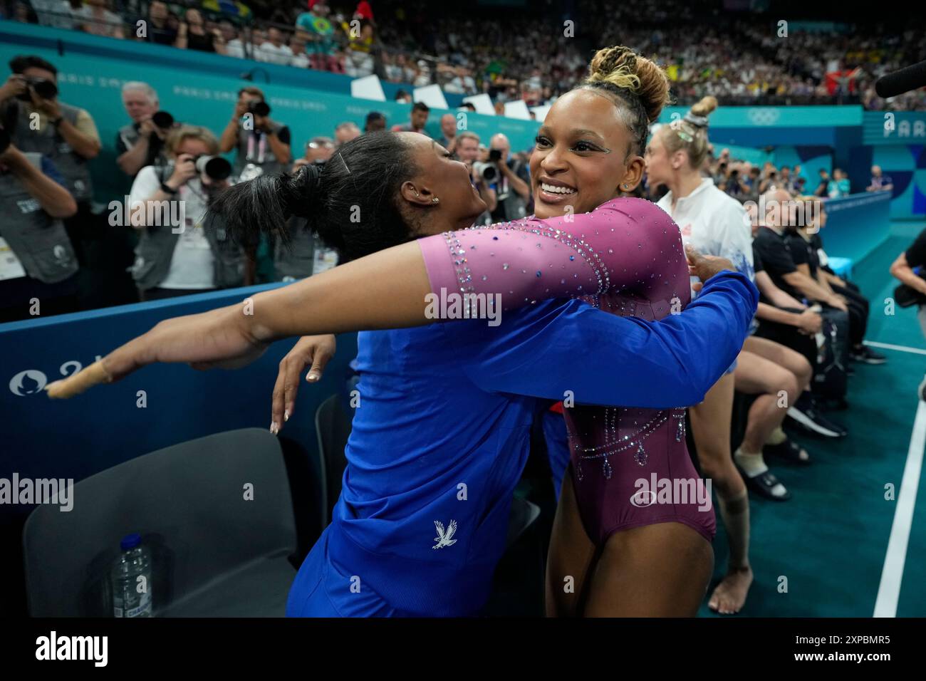 Simone Biles, left, of the United States, and Rebeca Andrade, of Brazil ...