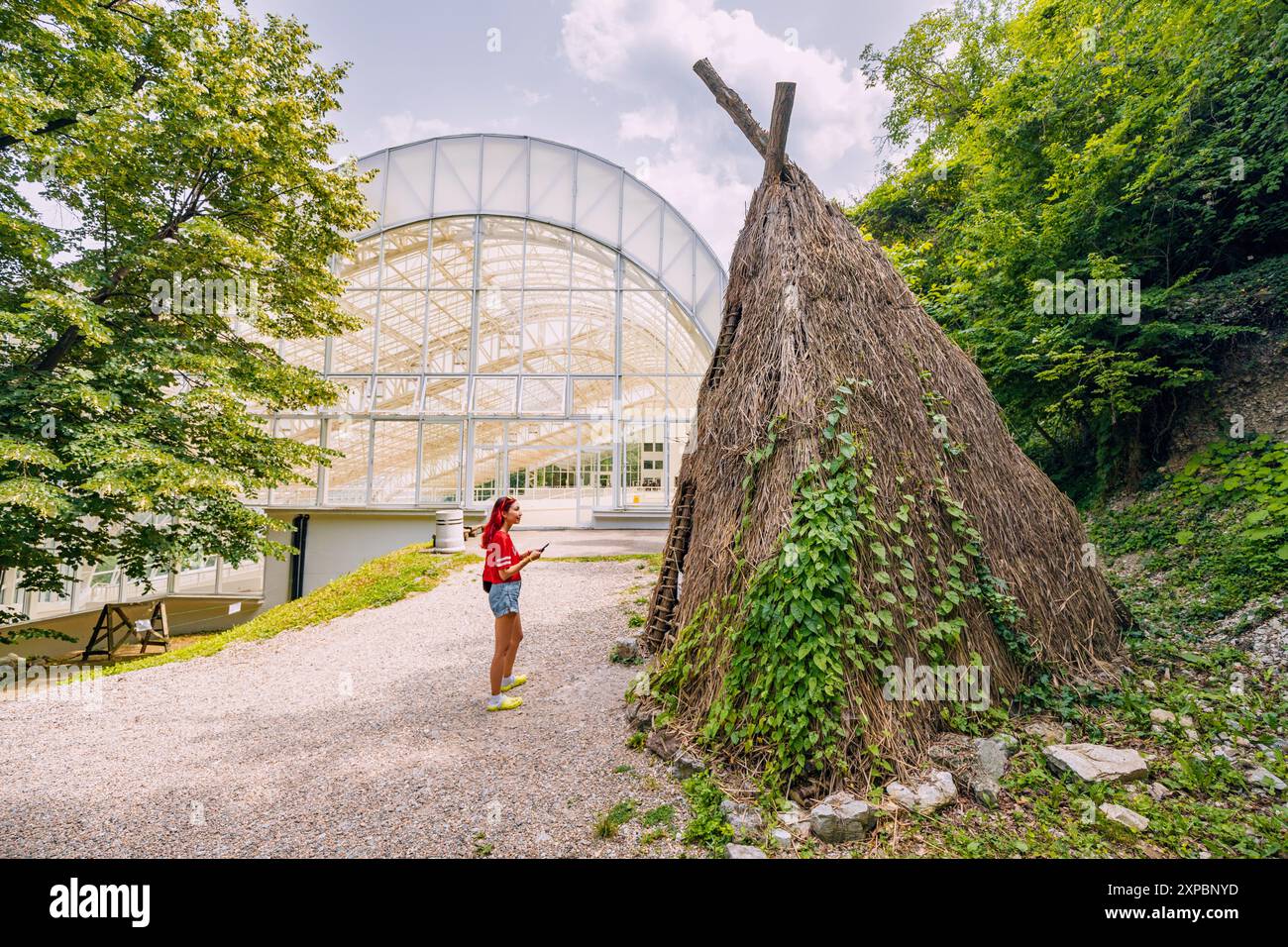 09 June 2024, Boljetin, Serbia: Visitor exploring ancient huts and ... 09 June 2024, Boljetin, Serbia: Visitor exploring ancient huts and ...
