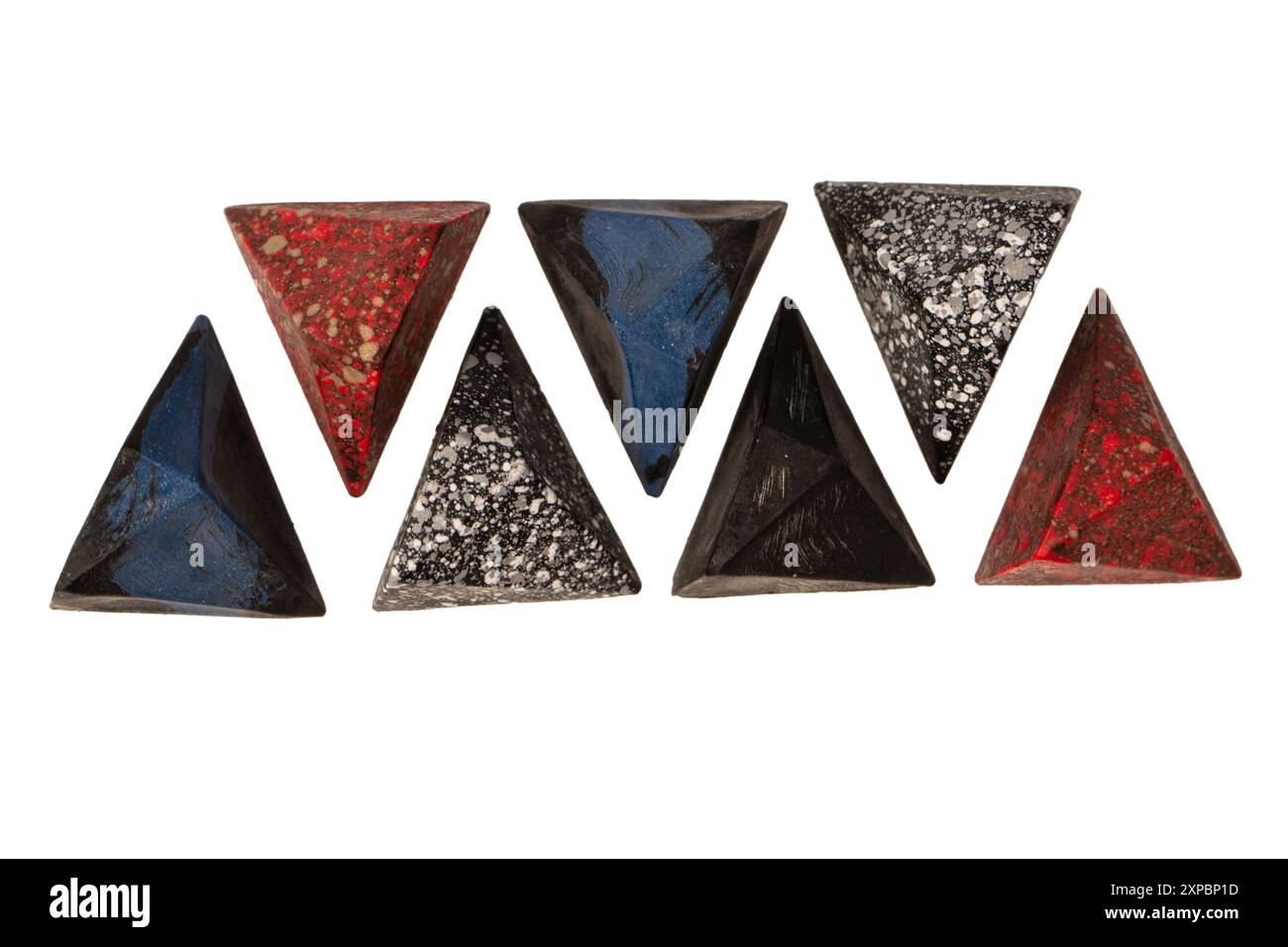 Chocolate candies in the form of precious stones, with marble texture ...