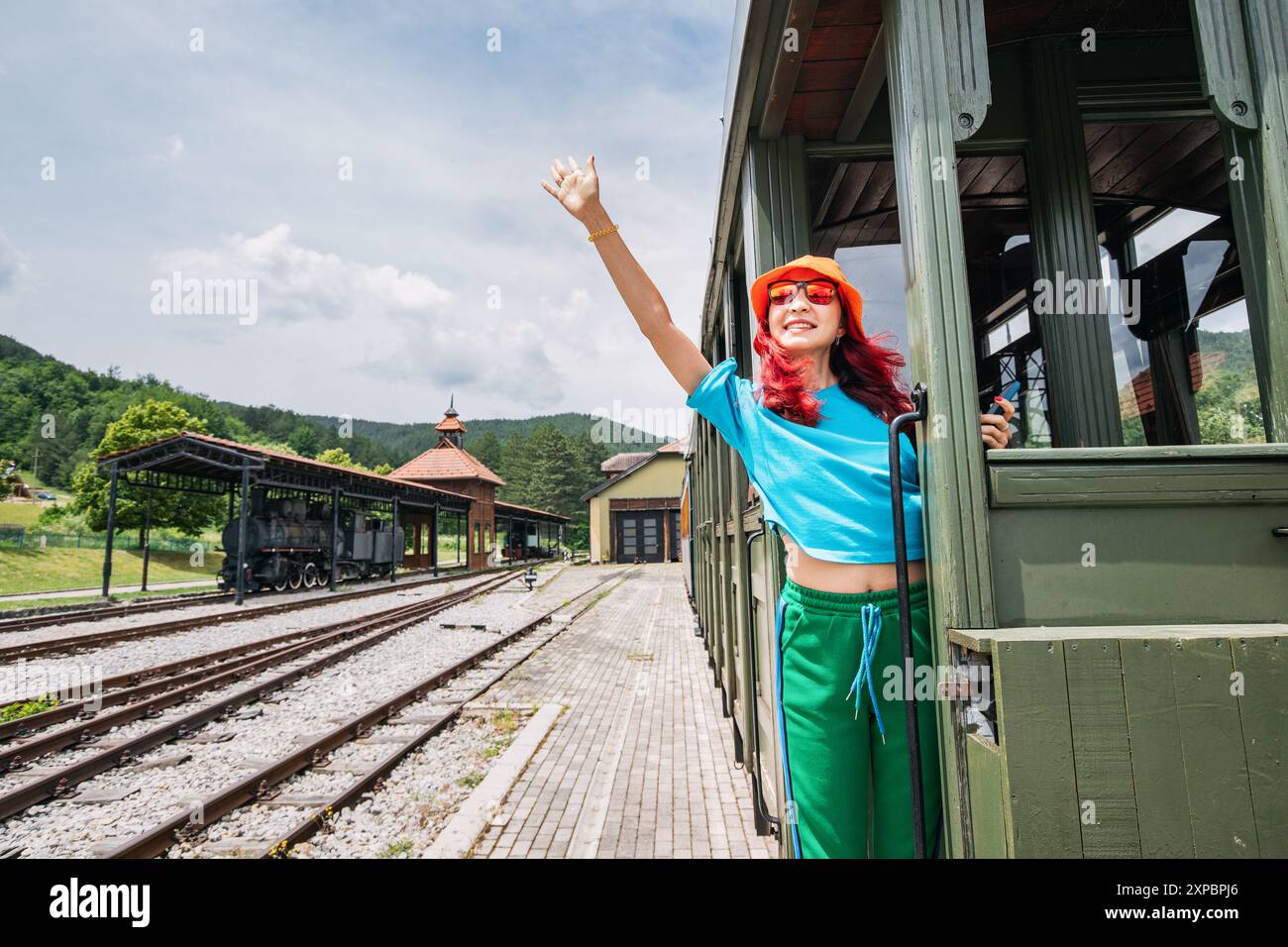 Person waving train station hi-res stock photography and images - Alamy