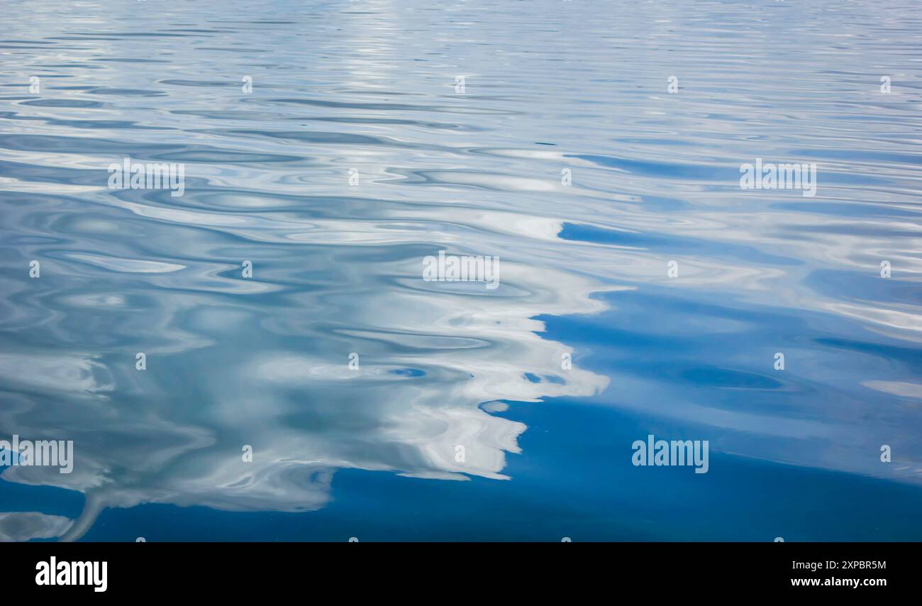 Blue water with ripples on the surface. Defocus blurred transparent ...