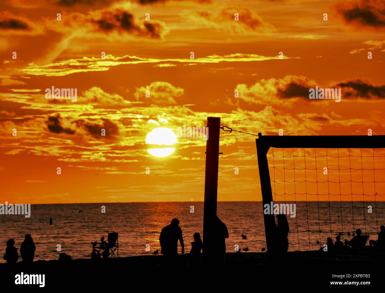 A tropical sunset over a volleyball court Stock Photo - Alamy