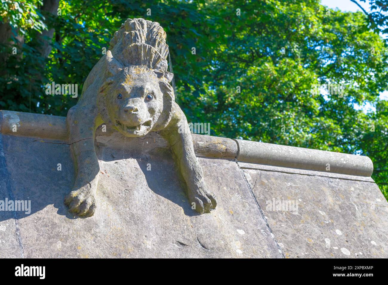 A stone hyena on Animal Walk, Bute Park, Cardiff UK. Sculpture in 1880s ...