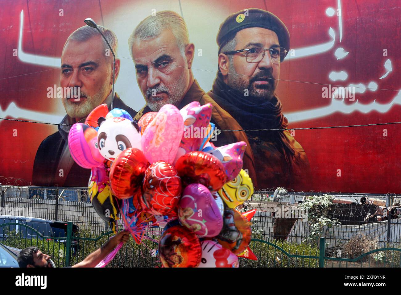 Beirut, Lebanon. 05th Aug, 2024. A huge poster showing (Lto R ...