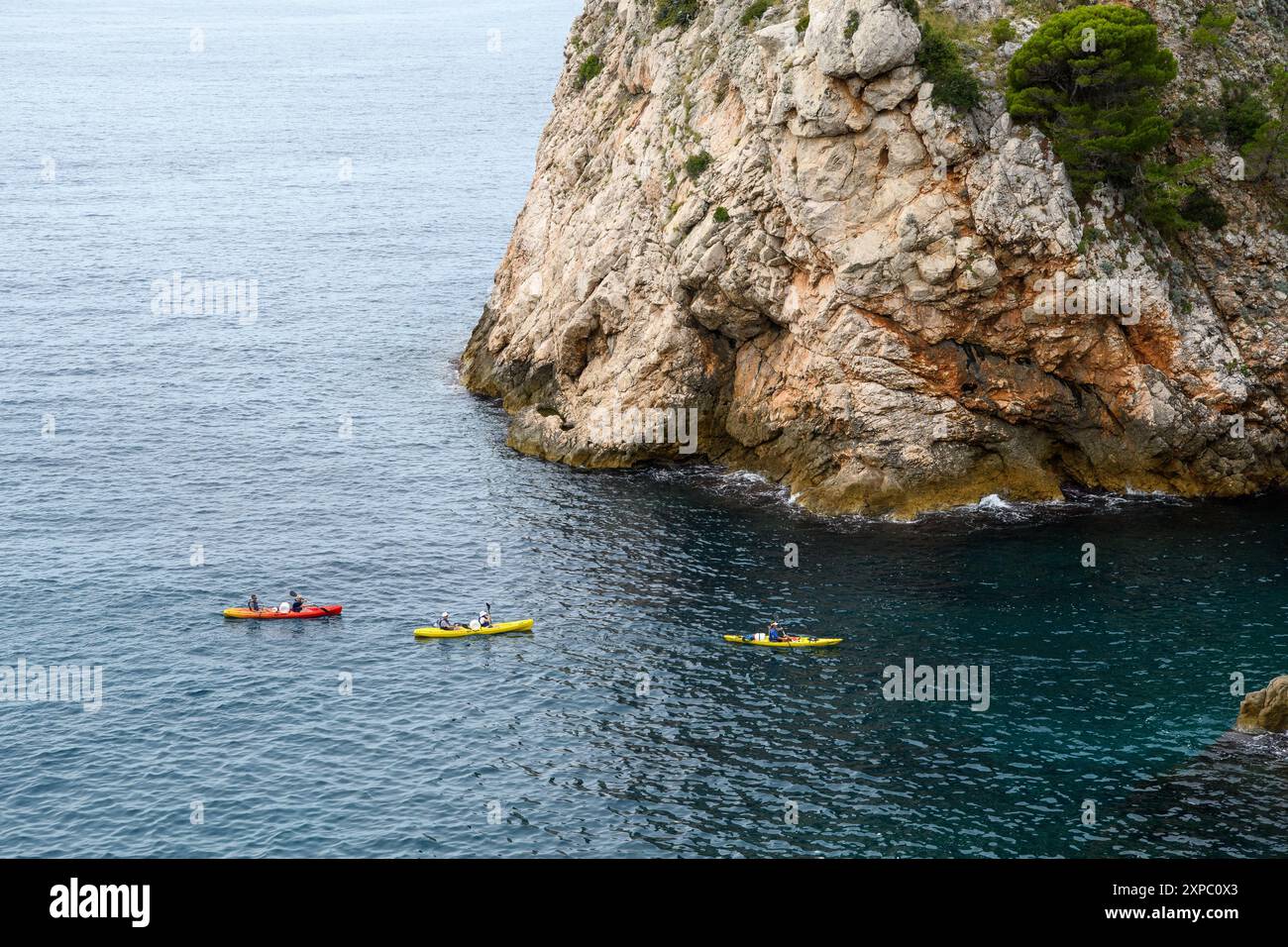 Group kayaking exploration sea caves hi-res stock photography and ...