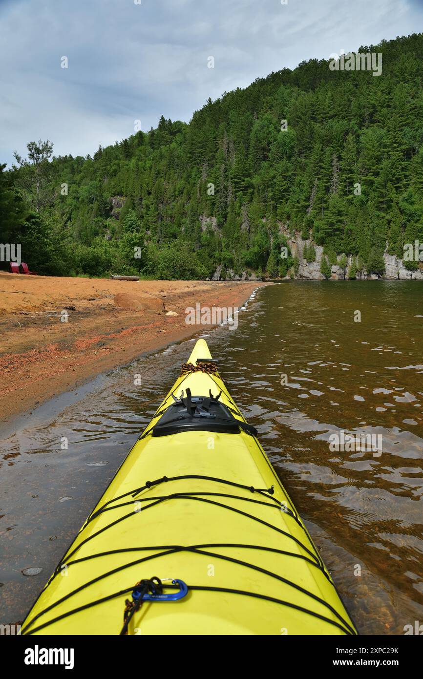 Yellow sea kayak at sand beach on the Wapizagonke lake. Canada Park La ...