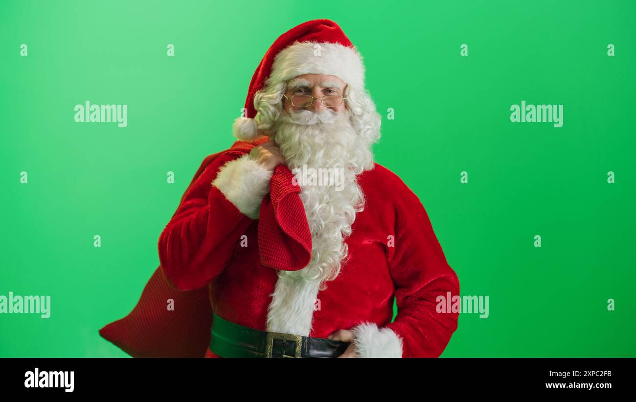 Santa holding gifts green screen hi-res stock photography and images ...