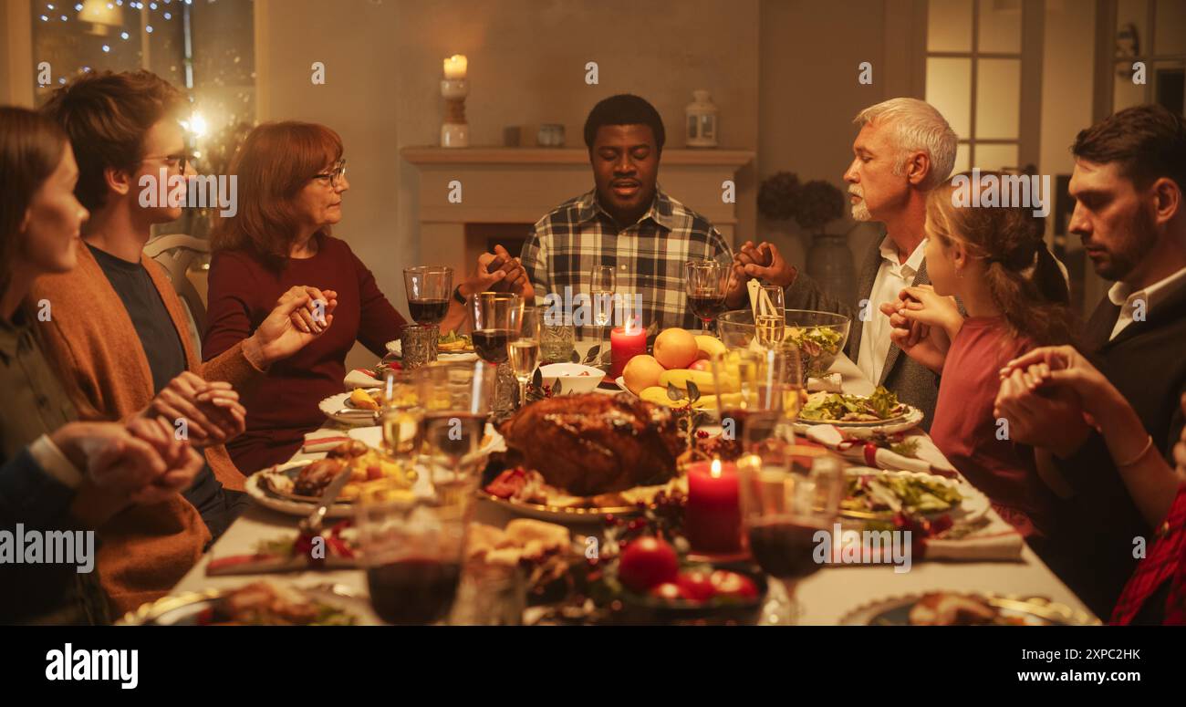 Portrait of a Young Black Man Sitting at a Festive Table with Family ...